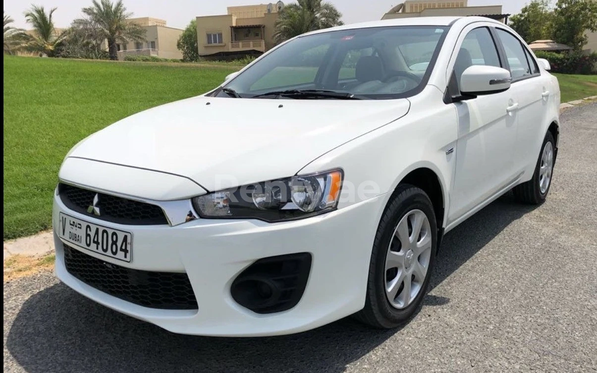 Rent a Mitsubishi Lancer (White), 2018 ID-2843, in Dubai - Evolve